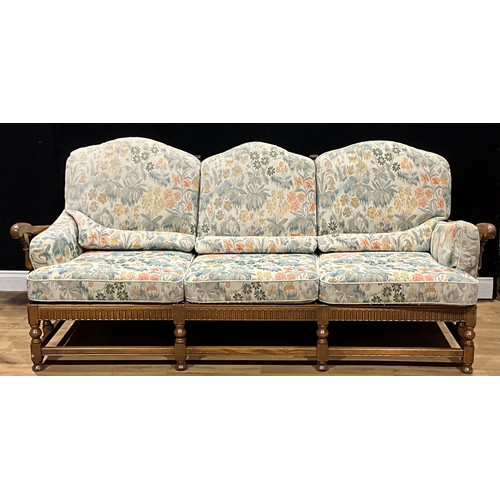 An Ercol Old Colonial sofa, 92cm high, 214cm wide, the seat 173cm wide ...