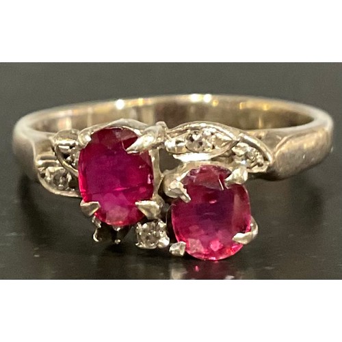 An 18ct white gold synthetic ruby doublet and diamond ring, set with ...