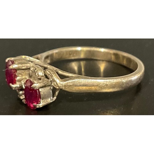 An 18ct white gold synthetic ruby doublet and diamond ring, set with ...