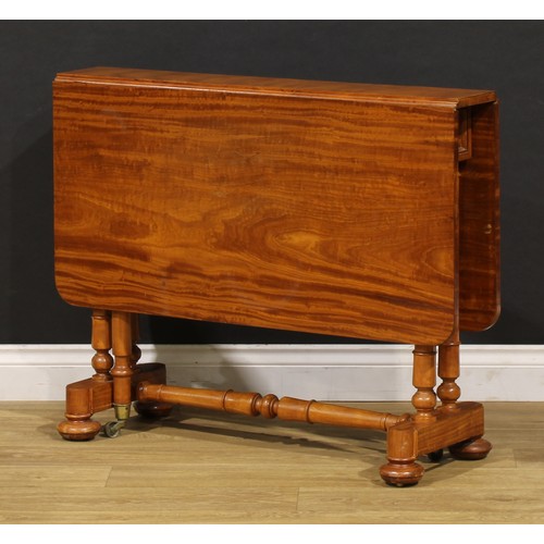 A Victorian satinwood Sutherland table, rounded rectangular top with ...