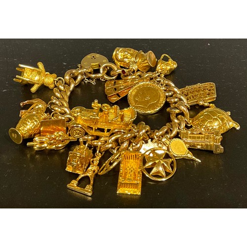 A 9ct gold charm bracelet full of charms, charms to include a 9ct gold ...