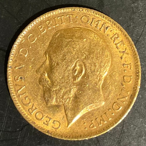 A 1914 George V half sovereign coin, featuring King George V on the ...