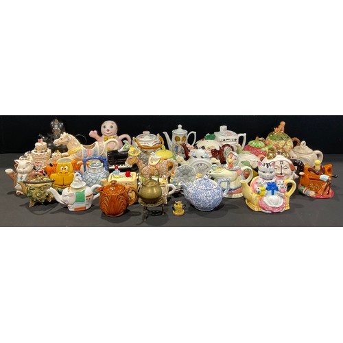 Teapots - a collection of novelty teapots including a Carton Ware ...