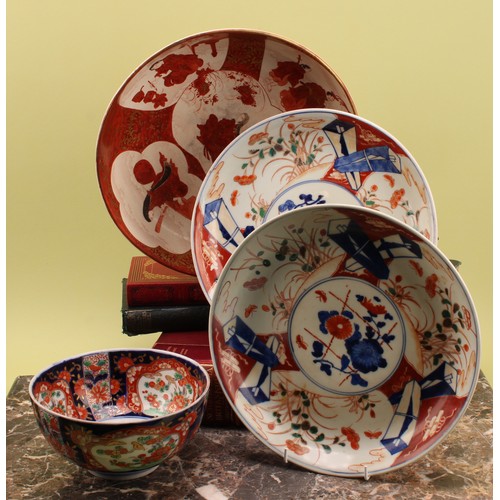 A Japanese satsuma bowl, decorated in tones of iron red and gilt with ...