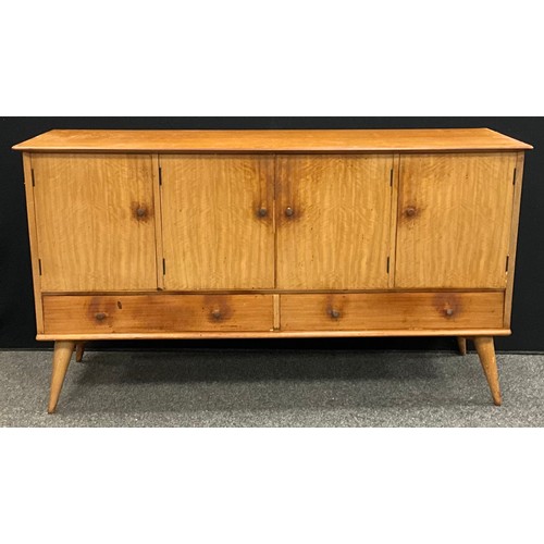 A midcentury mahogany sideboard, veneered in satinwood, oversailing top ...