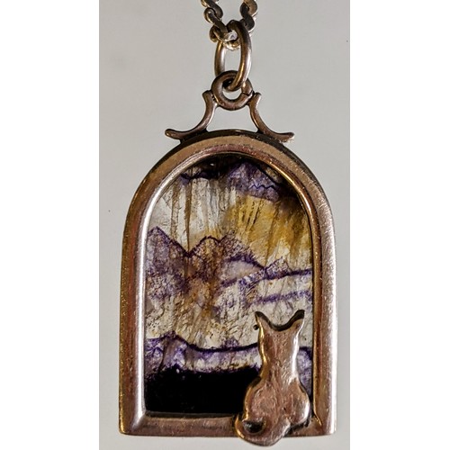 A silver blue john pendant necklace, set with a silver mounted arch ...