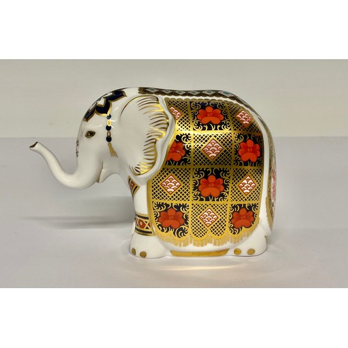 A Royal Crown Derby paperweight, Imari Elephant, trunk raised ...