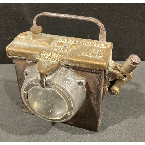 Coal Mining - a brass and steel pony lamp, by Davis Derby