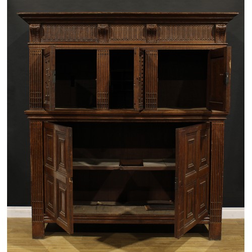 A substantial Charles II Revival oak aumbry or livery cupboard, moulded ...