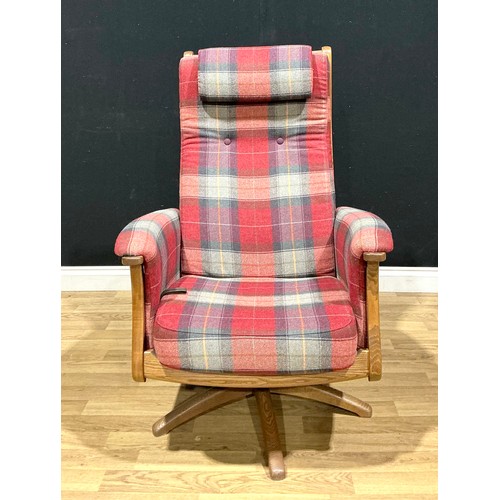 An Ercol Gina reclining swivel lounge chair, 113.5cm high, 77cm wide ...