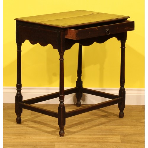 A William III oak side table, oversailing two-plank top above a frieze ...