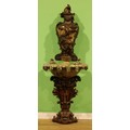 A Rococo Revival softwood lavabo or fountain, the cistern carved and ...