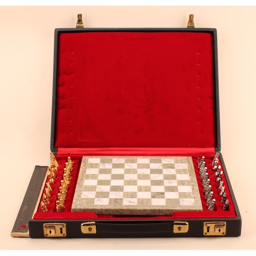 An Asprey and Co. 9ct gold chess set, the pieces in white and yellow ...