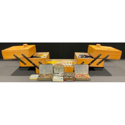 A mid-20th century folding haberdashery box, containing an assortment ...