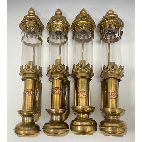 A pair of brass GWR wall mounted brass carriage lamps with glass shades ...