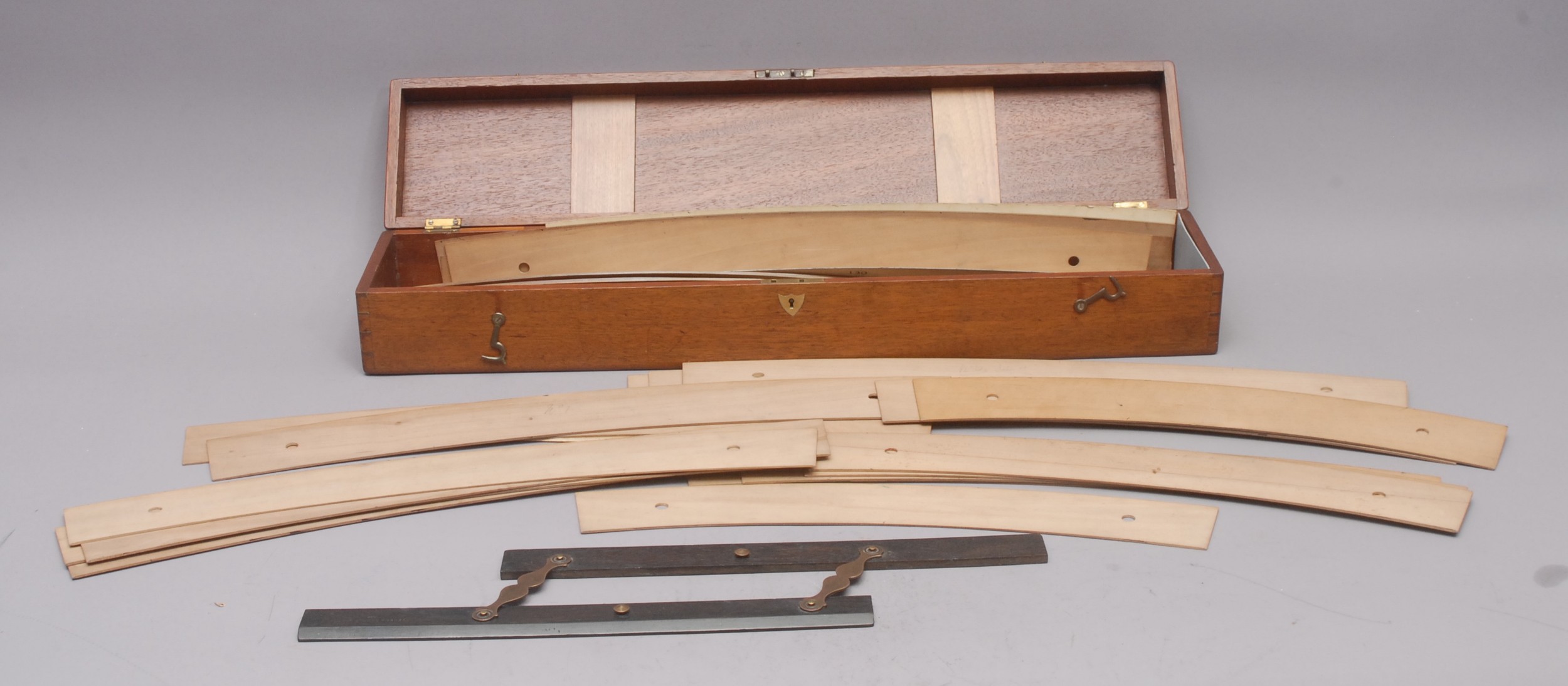 A set of early 20th century pear wood draughtsman's railway curves, the ...