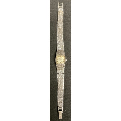 Longines - a vintage ladies silver cased bracelet wristwatch, textured ...