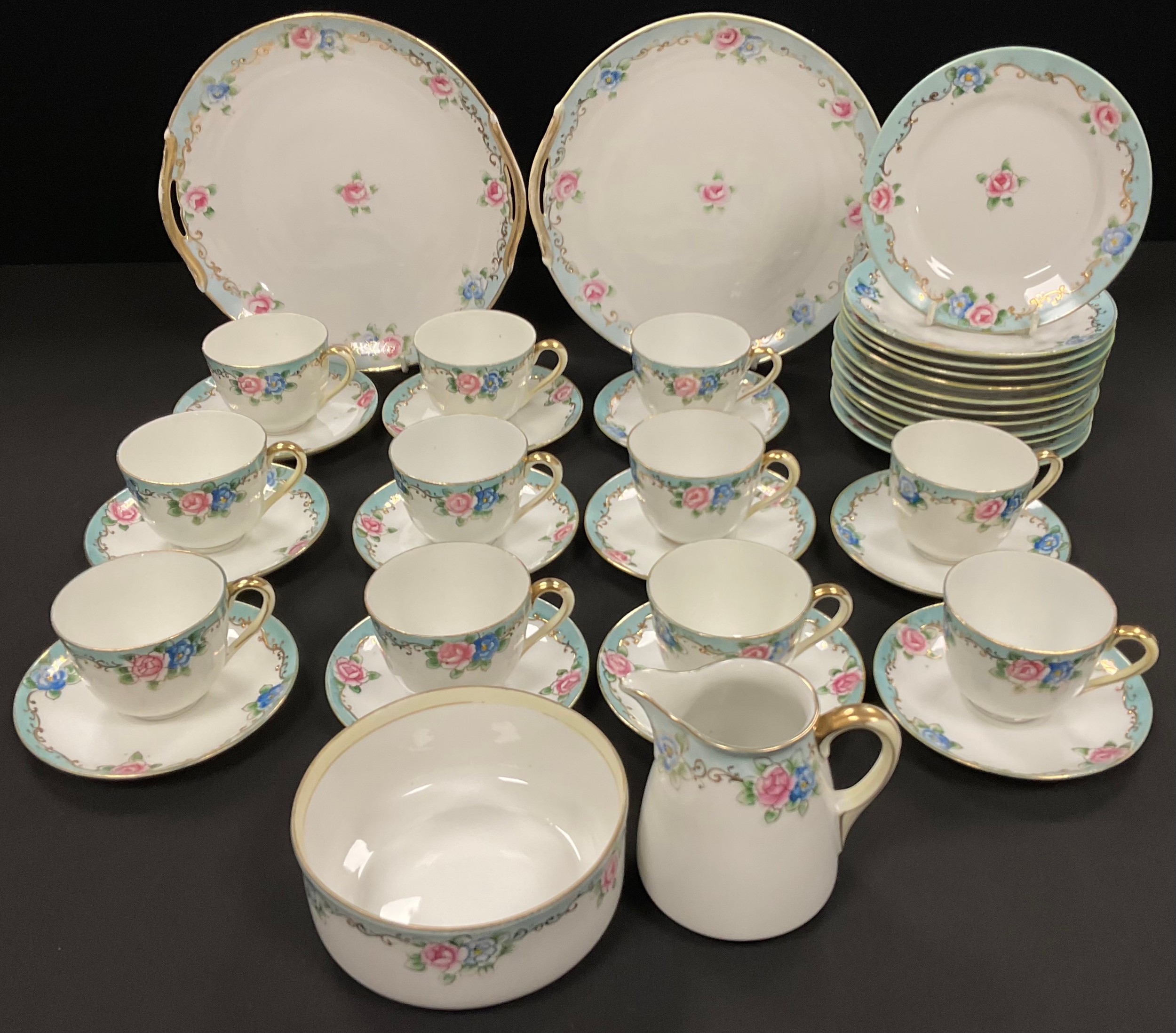A Japanese Noritake tea set, comprising eleven teacups and saucers ...