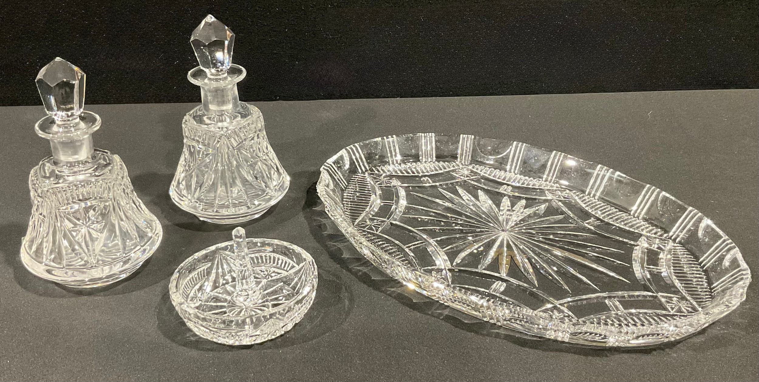 An Art Deco cut glass dressing table set comprising pair of scent ...