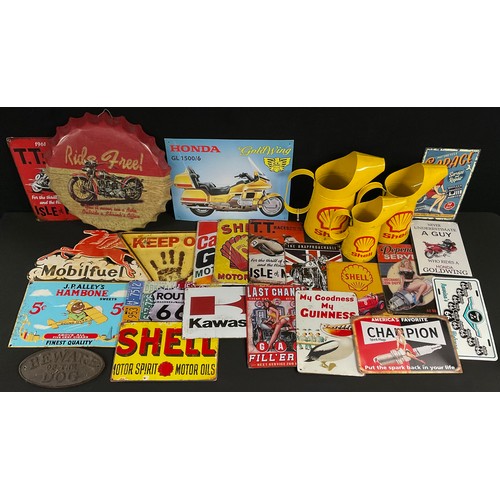 A collection of reproduction advertising signs, including BSA ...