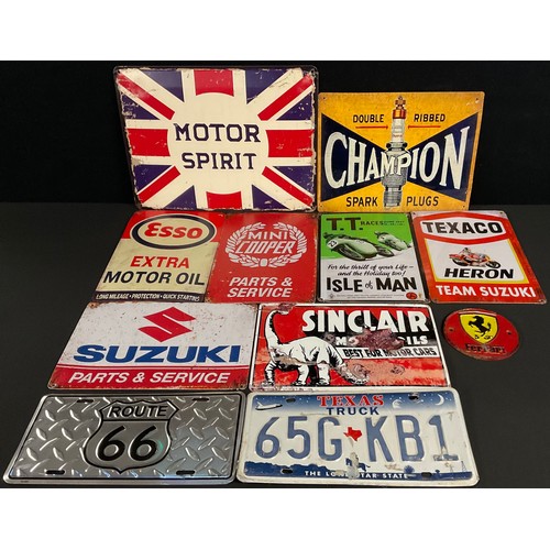 A collection of reproduction advertising signs, including BSA ...