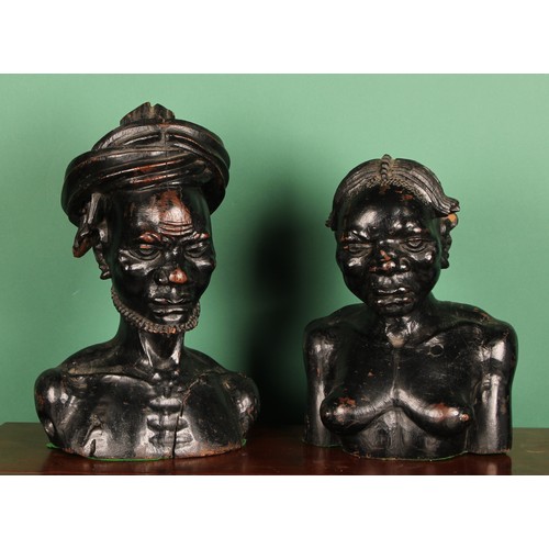 A pair of ebonised portrait busts, carved as Nubian male and female ...