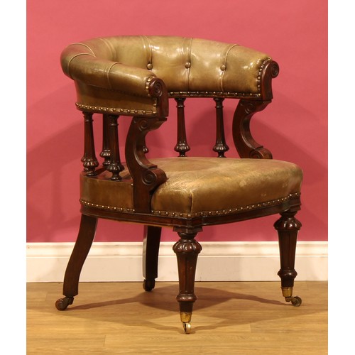 A Victorian mahogany club chair or desk chair, stuffed-over upholstery ...