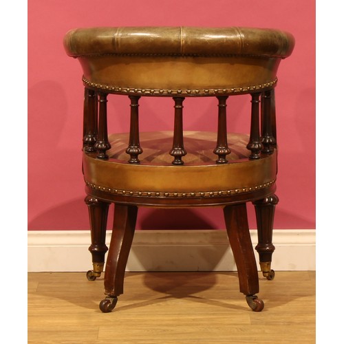 A Victorian mahogany club chair or desk chair, stuffed-over upholstery ...