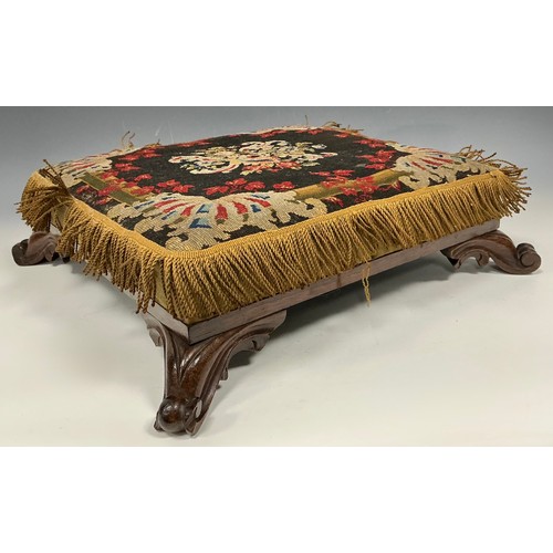 A Victorian rosewood footstool, stuffed over woolwork upholstery ...