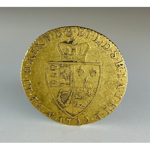 A 1790 George III gold guinea coin, on the obverse a laureate portrait ...