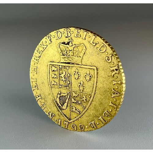 A 1790 George III gold guinea coin, on the obverse a laureate portrait ...