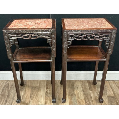 A pair of Chinese hardwood side tables, the rectangular top inset with ...