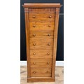 A Victorian mahogany Wellington chest, oversailing top above seven ...