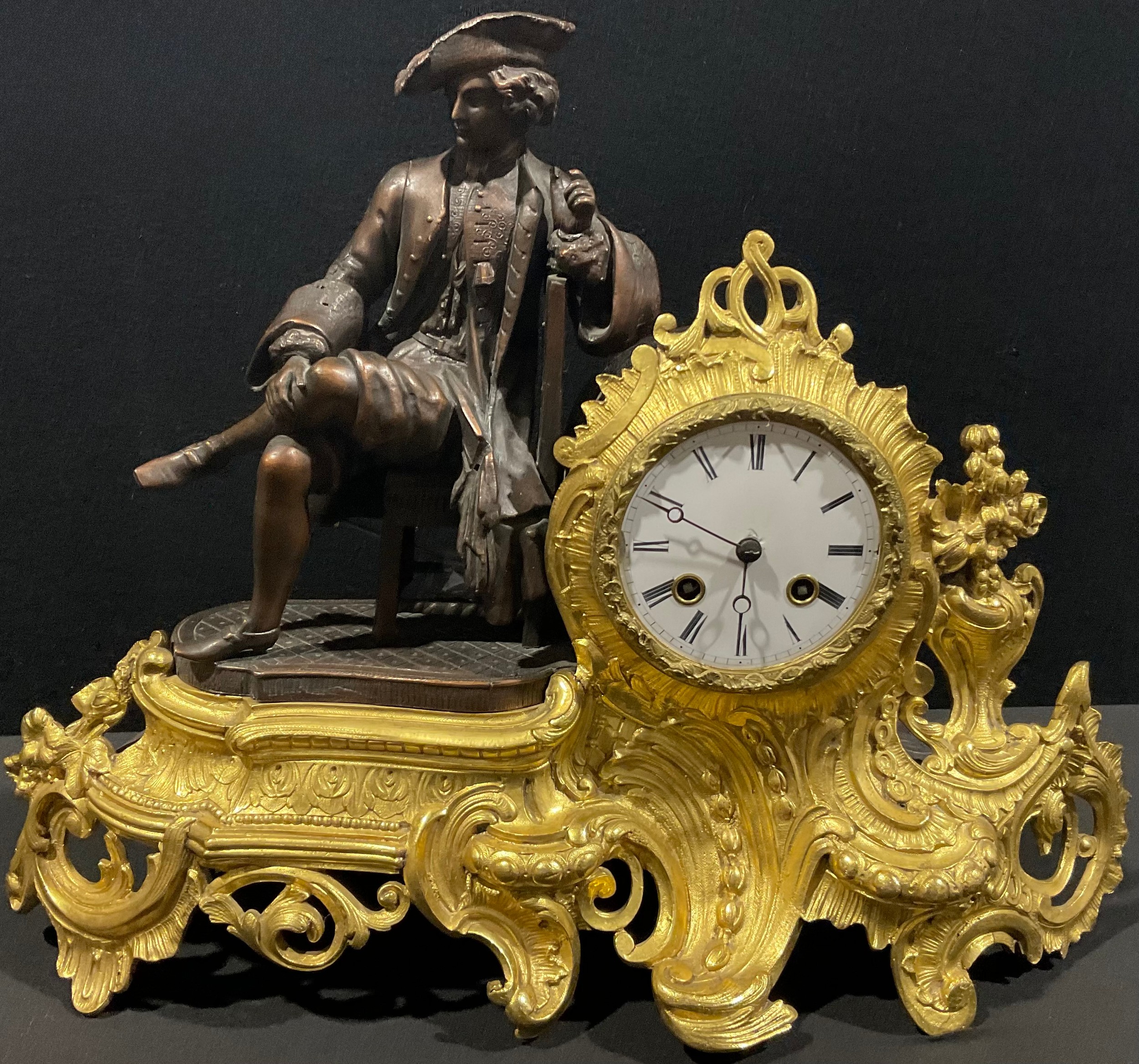 A French parcel gilt and dark patinated figural mantel clock, 8cm ...