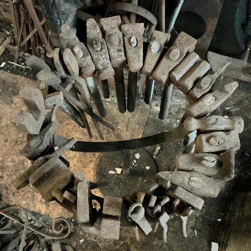 Blacksmith’s Tools - various hammers and forging tools on a wrought ...