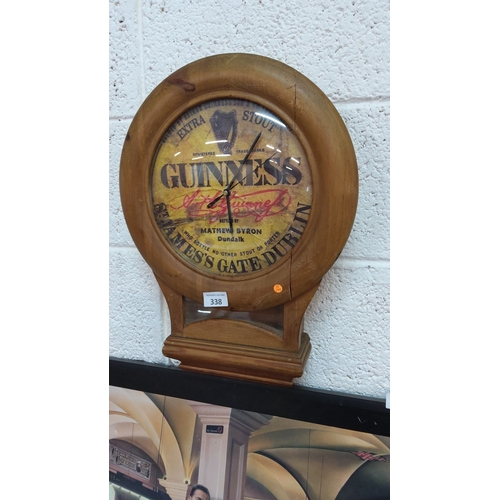 Wooden framed Guinness clock features vintage advertising design with ...