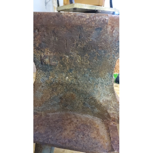 Cast iron British army field anvil with square hardy hole, mounted on a ...