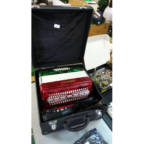 Red pearloid Baronelli piano accordion with green treble grille ...