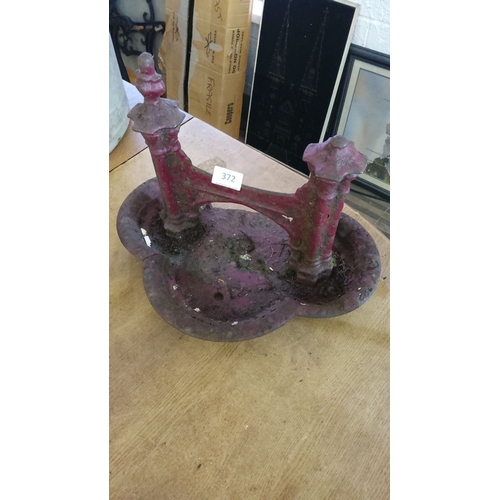 19th-century cast iron boot scraper, twin octagonal posts linked by ...