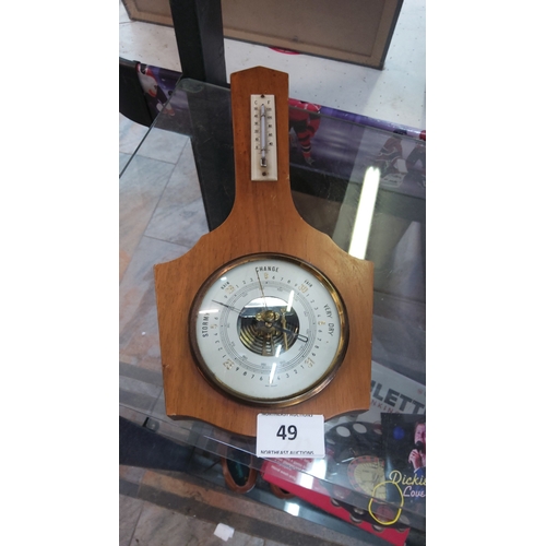 Mid-century wall-mounted aneroid barometer with central visible ...