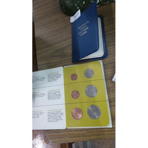 Two Royal Mint wallets, each holding Britain’s six-coin inaugural ...