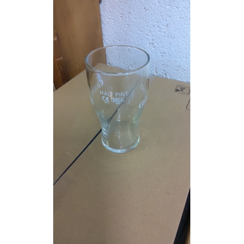 Set of 24 Guinness half pint glasses