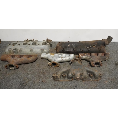 Ford Model T cylinder head and 1 other and 4 manifolds