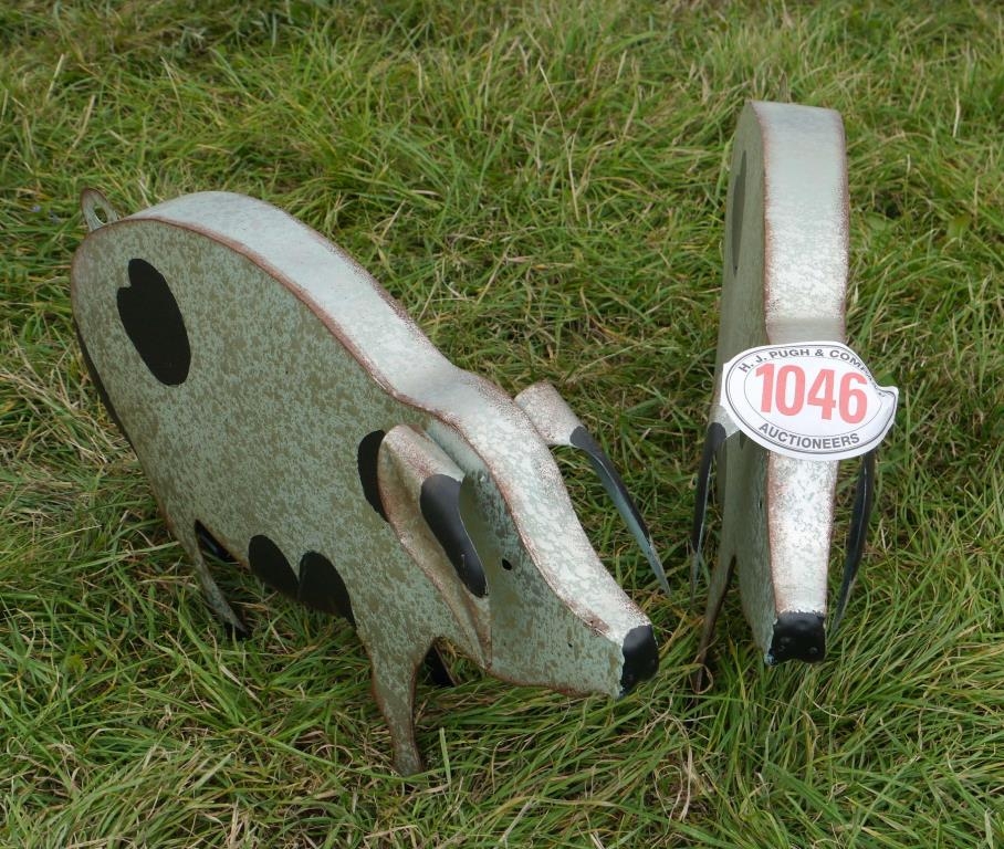 Pair of metal ornamental pigs +VAT