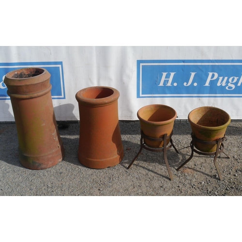 Clay chimney pots, and flower pots on stand