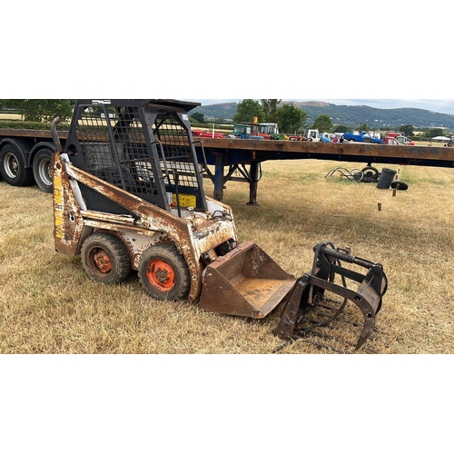 Bobcat Skidsteer loader with grab attachment. Runs and drives