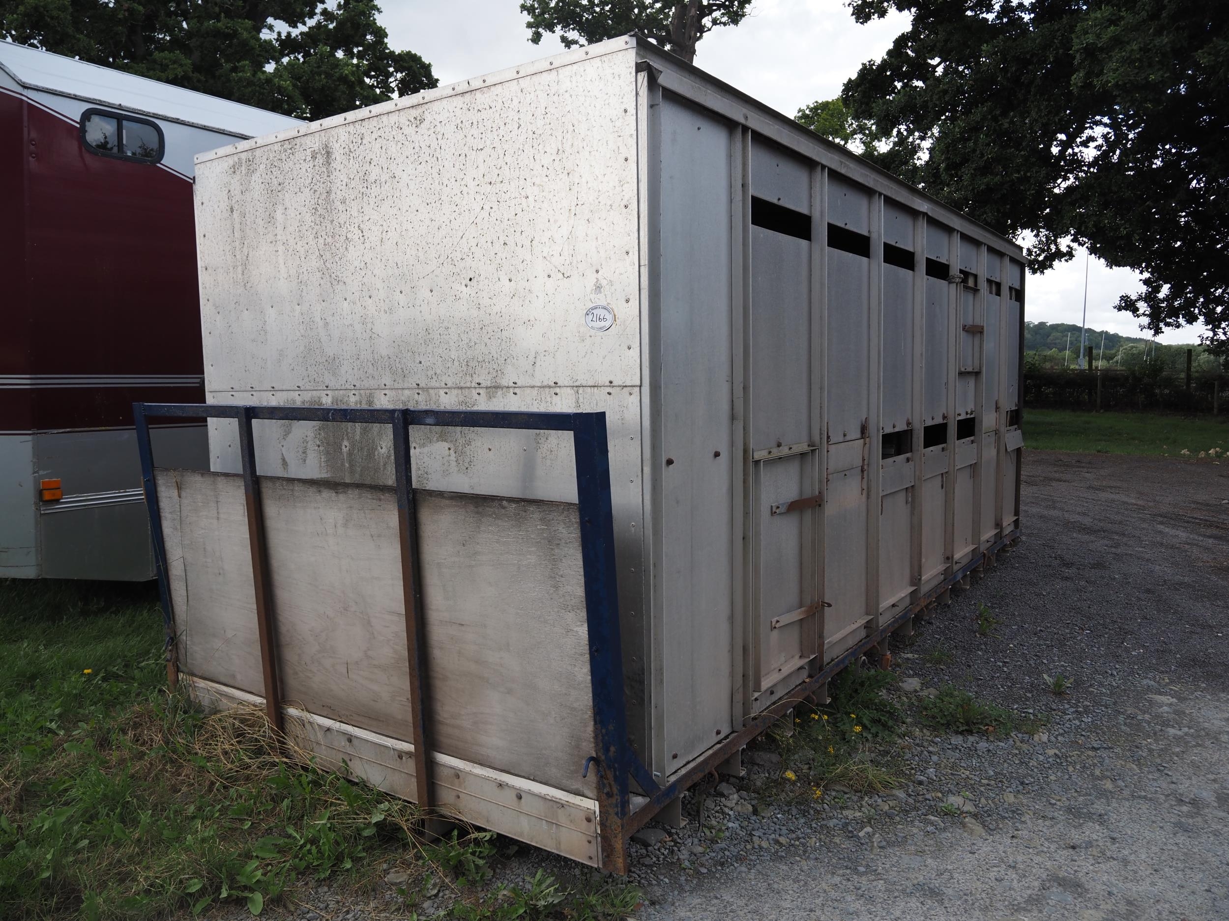 Aluminium livestock container on lorry bed