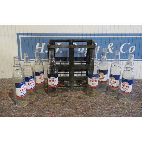Set of 8 quart Esso oil bottles and original rack