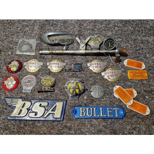 Various motorcycle badges and cast iron plaques