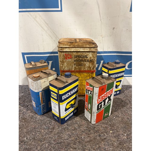 JCB oil drum and assorted oil cans
